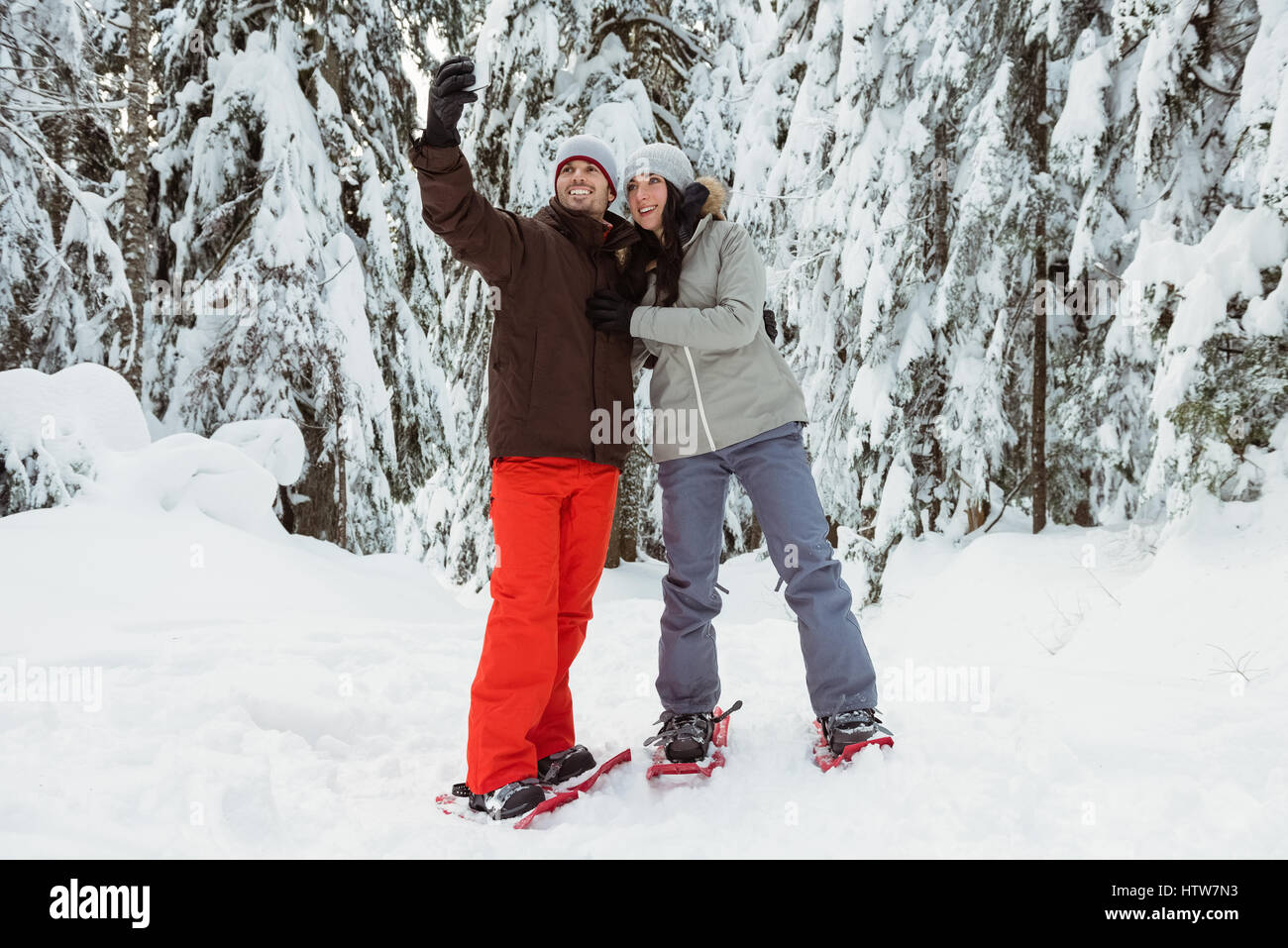 Photographing couple snow hi-res stock photography and images - Alamy