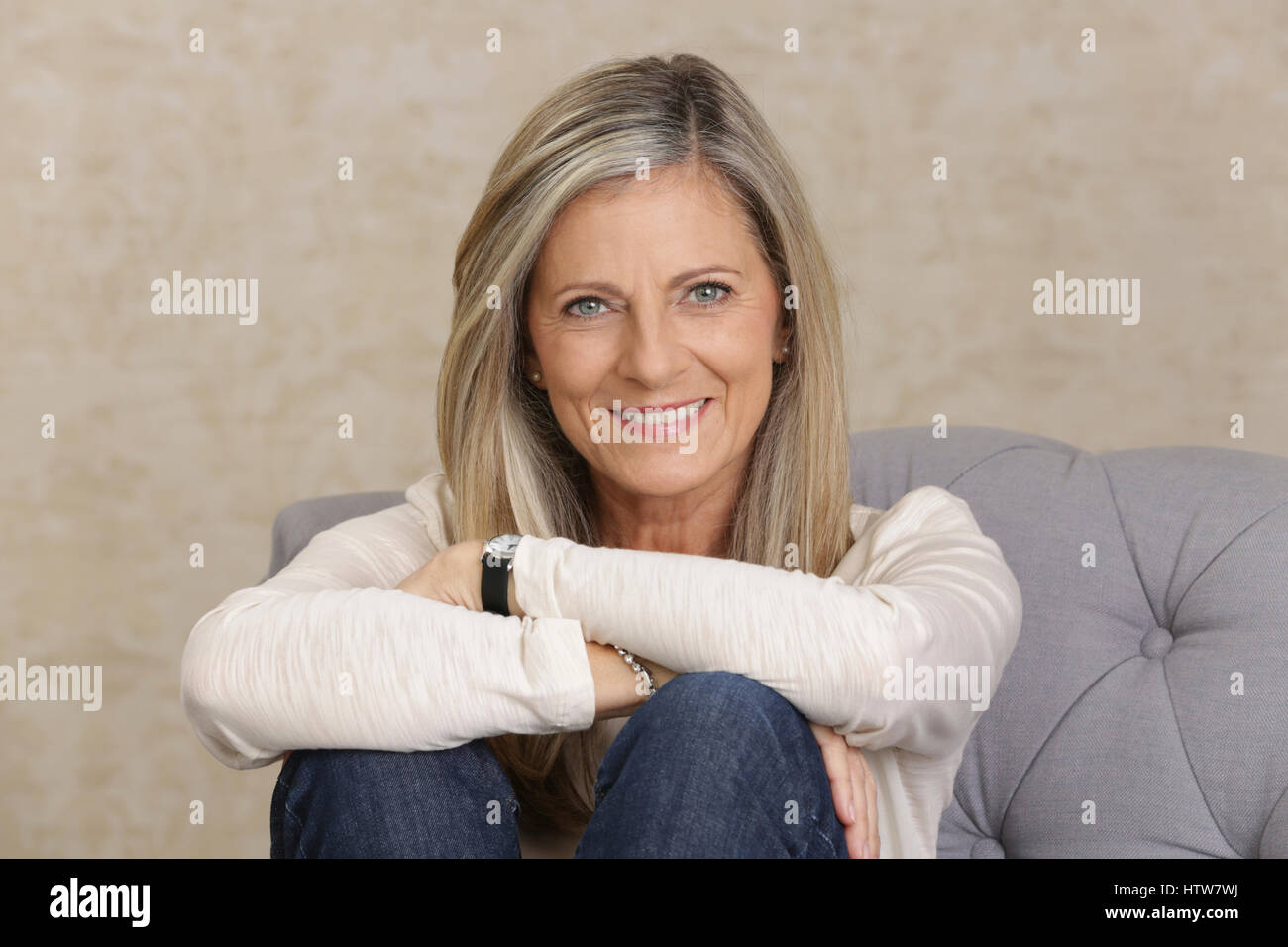 Attractive female middle aged one sofa hi-res stock photography and ...