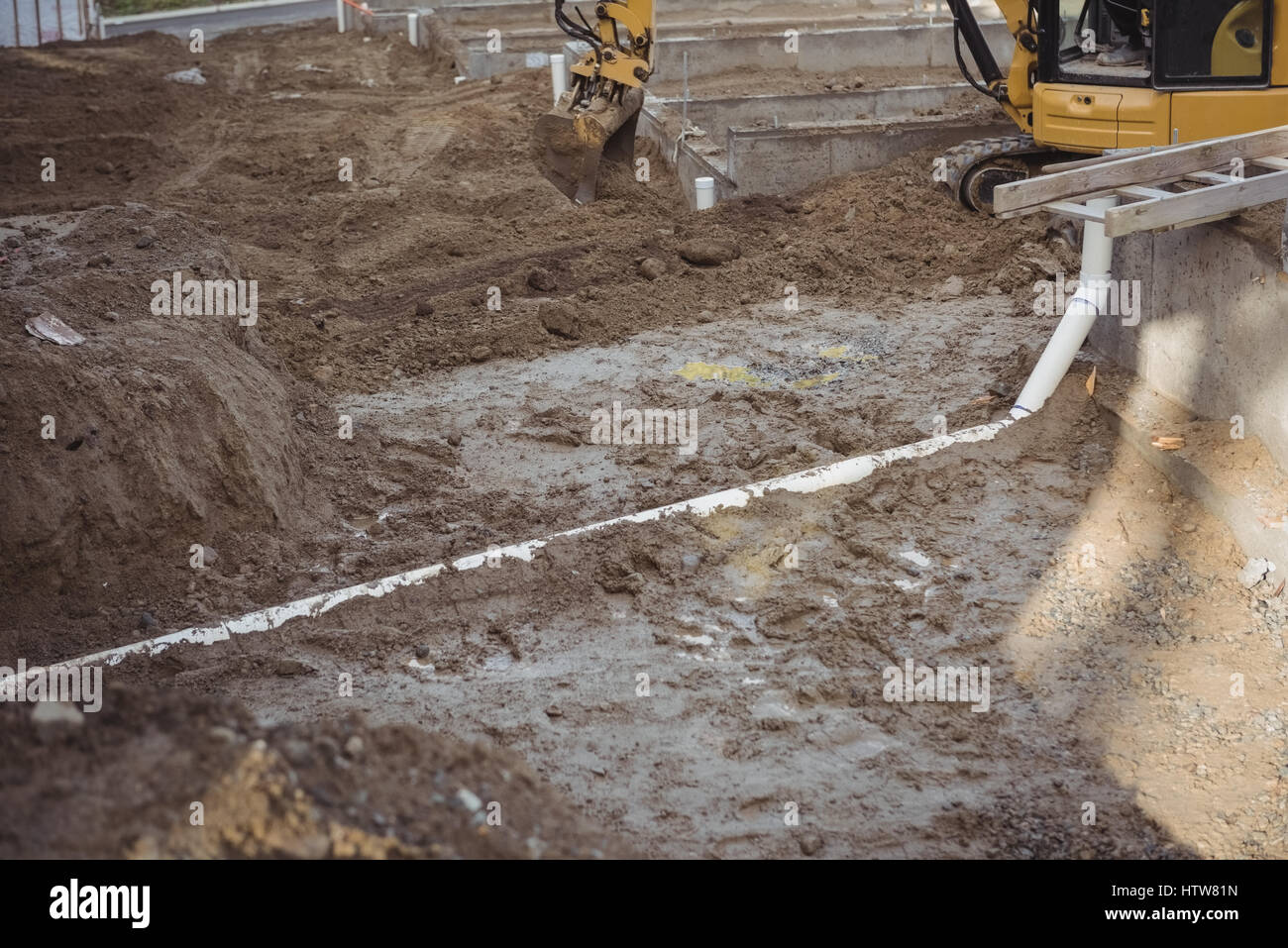 Drainage pipe under mud Stock Photo - Alamy