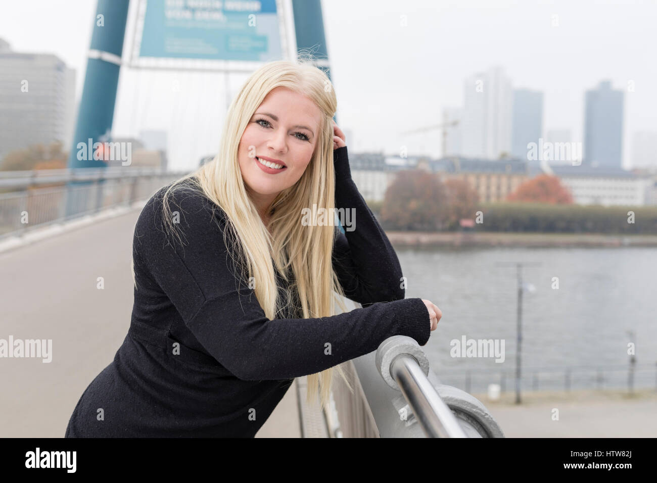 Woman young bridge stands hi-res stock photography and images - Alamy