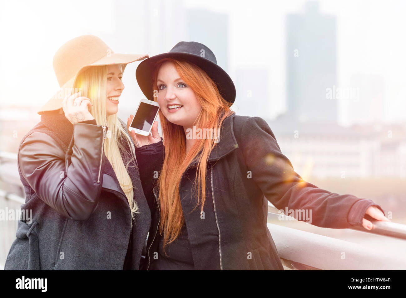 Friends listen to music together Stock Photo - Alamy