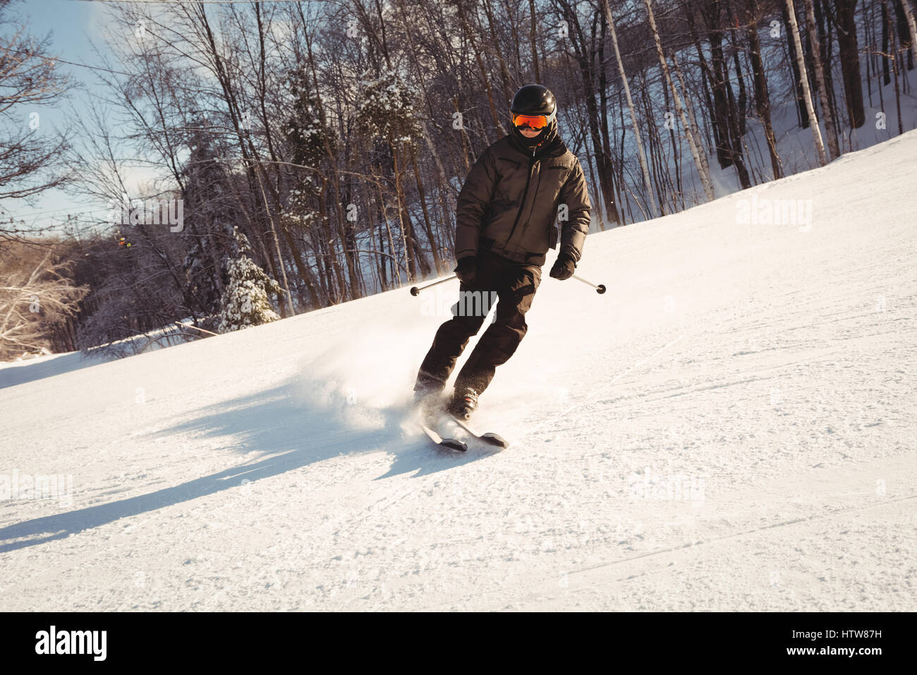 Skier skiing on the mountain slope Stock Photo - Alamy