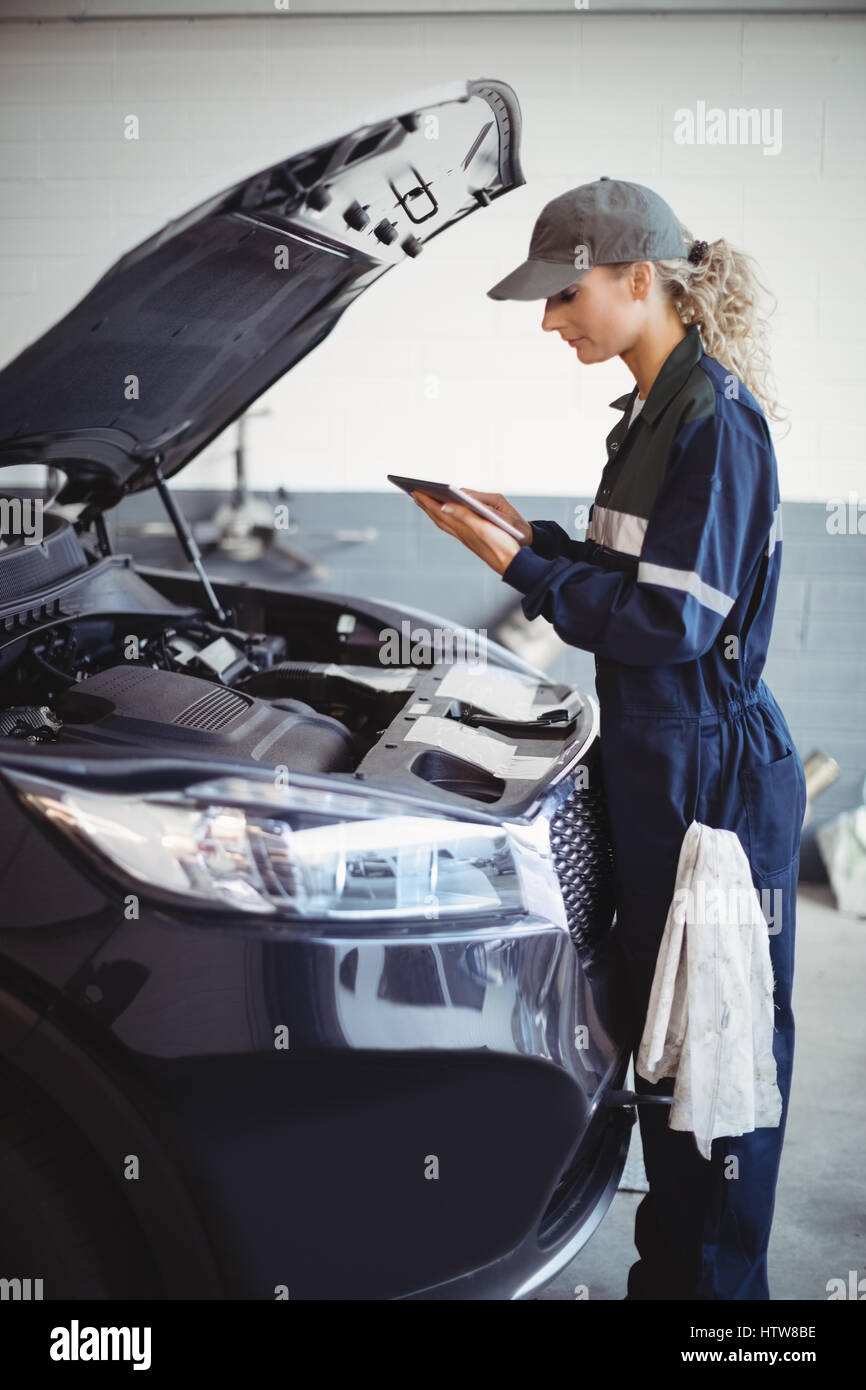 Female mechanic using digital tablet hi-res stock photography and ...