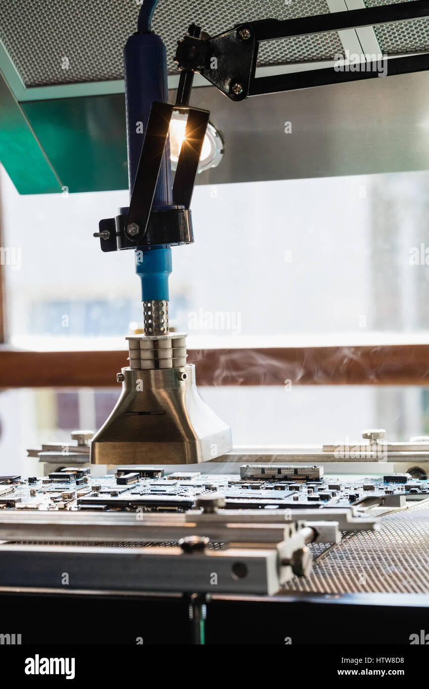 Laptop repairing machine Stock Photo - Alamy