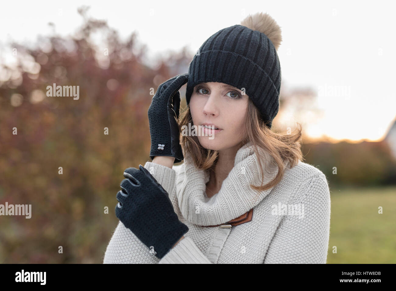 Young woman with cap Stock Photo - Alamy