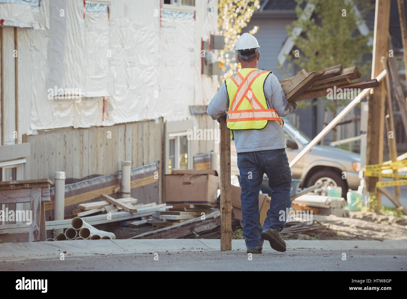 Construction worker working at construction site Stock Photo - Alamy