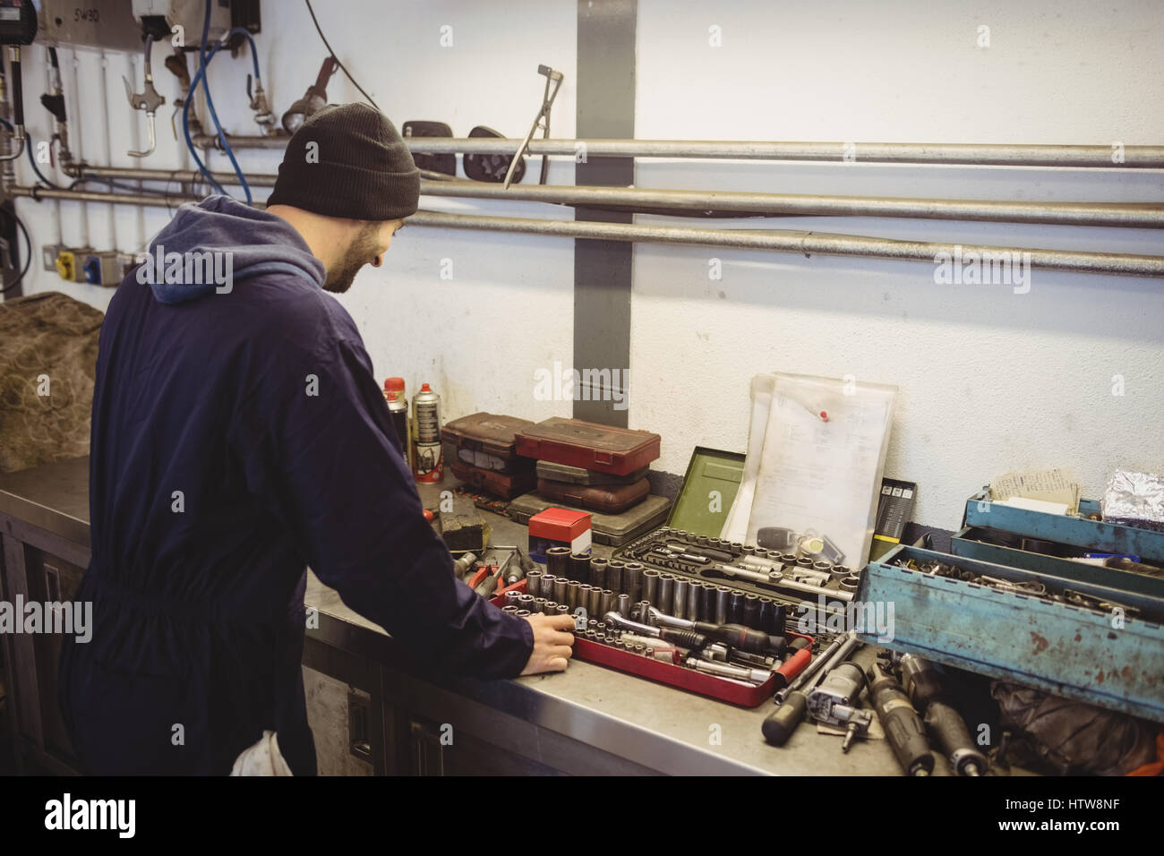 Mechanic checking various tools Stock Photo - Alamy