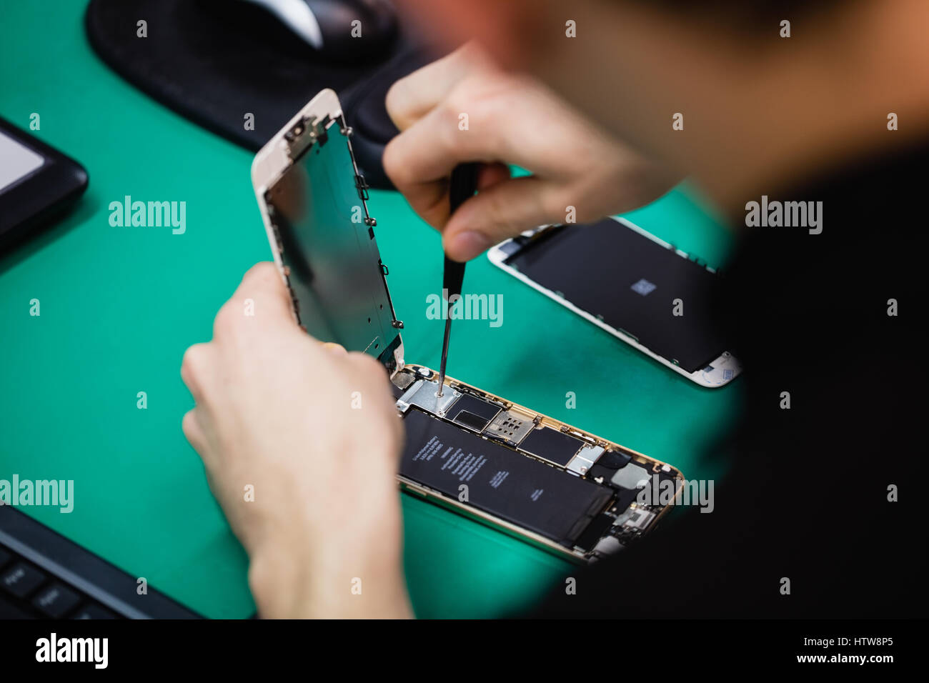 Man repairing mobile phone Stock Photo - Alamy