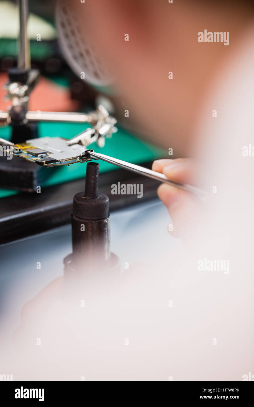 Man repairing mobile phone Stock Photo - Alamy