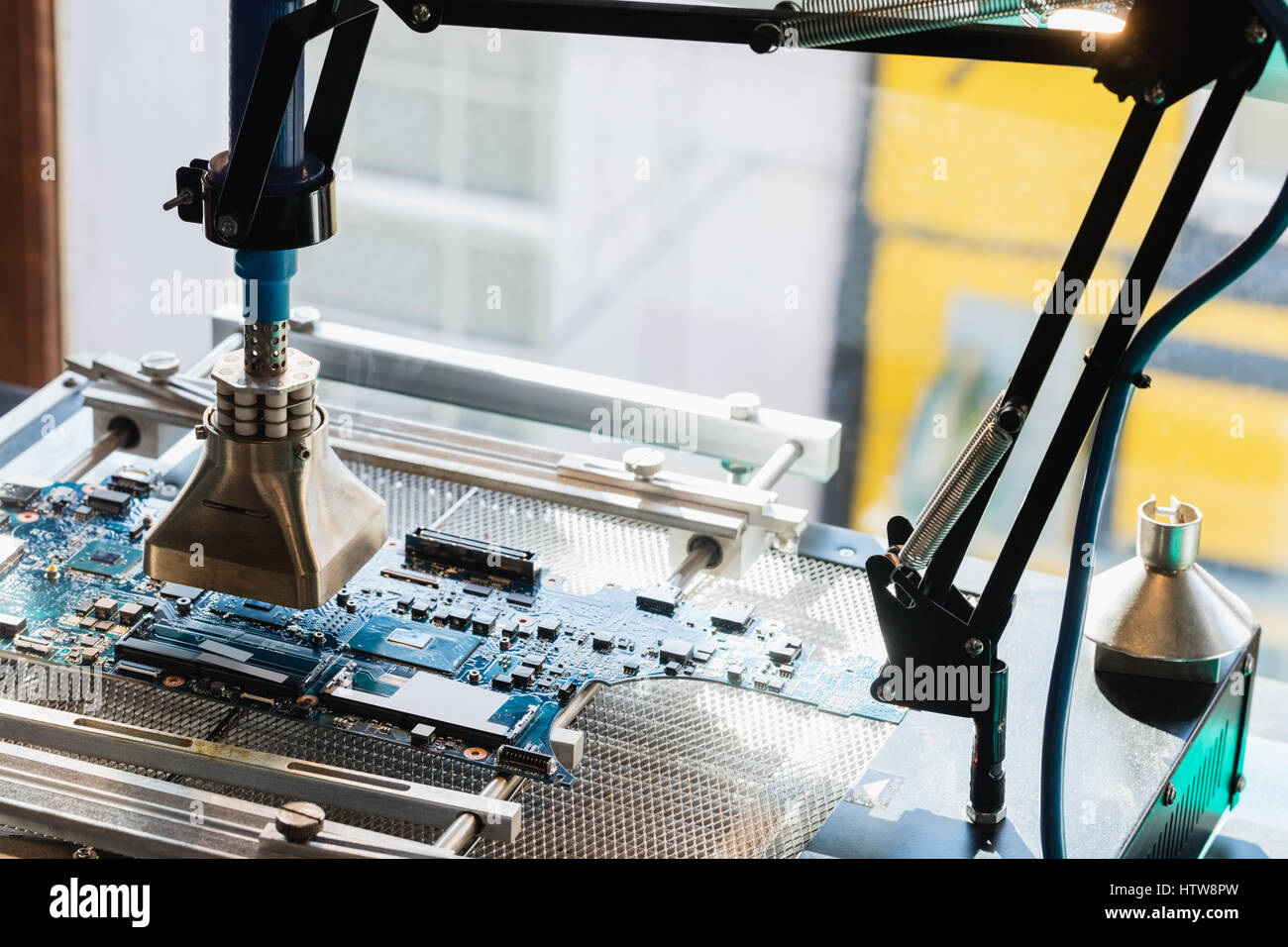 Laptop repairing machine Stock Photo - Alamy