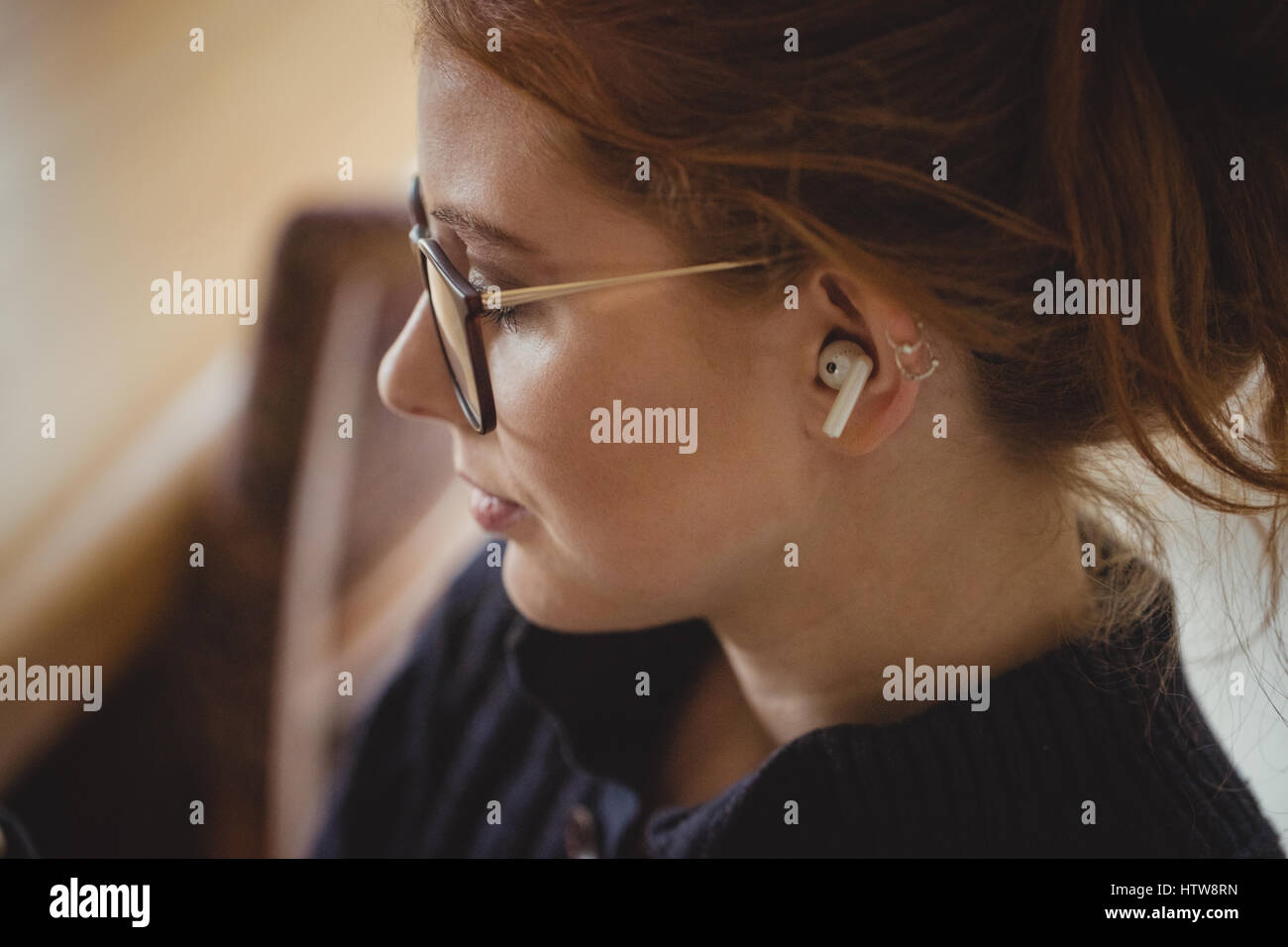 Woman wireless earphones hi-res stock photography and images - Alamy