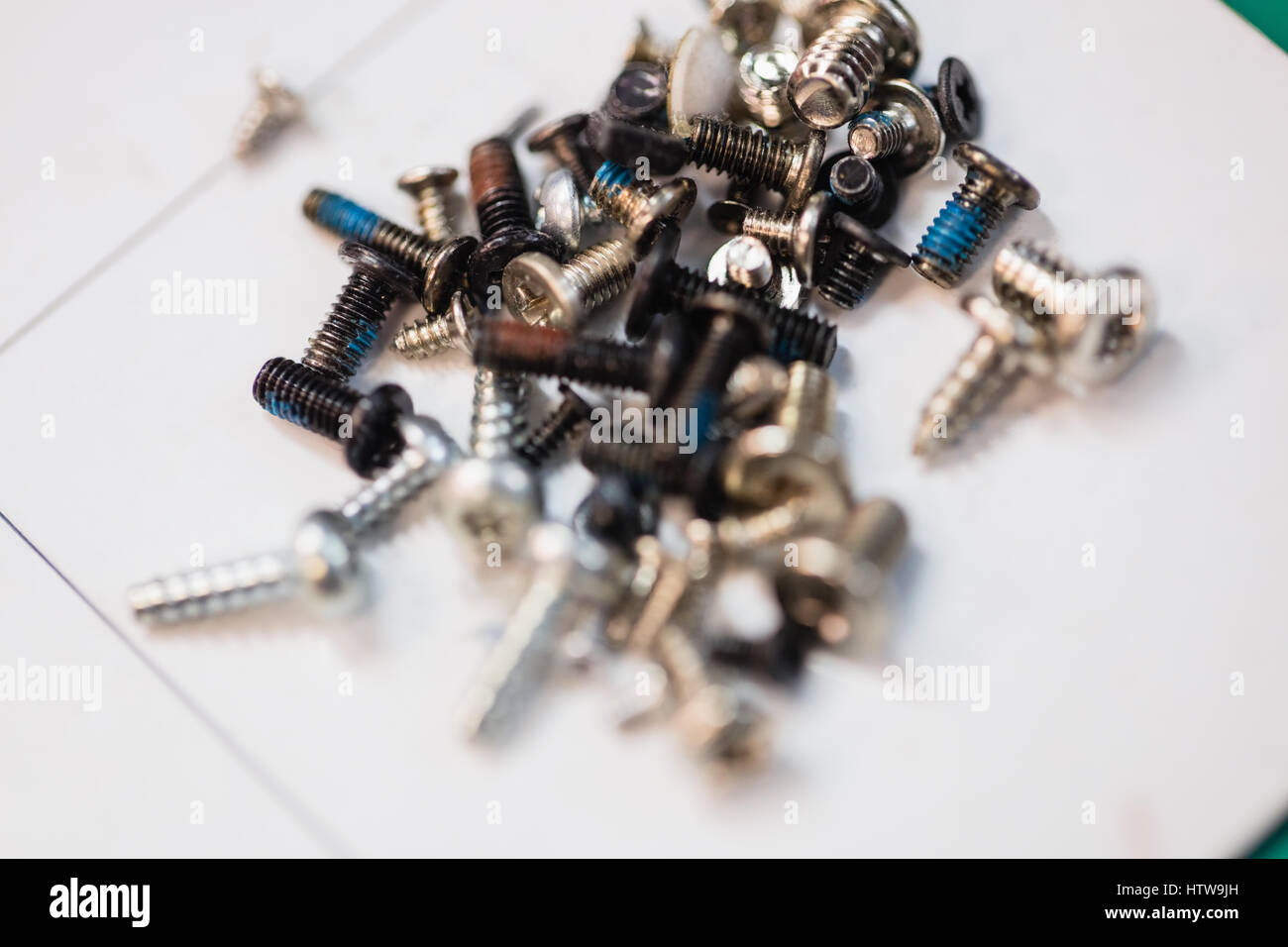 Various screws on table Stock Photo - Alamy