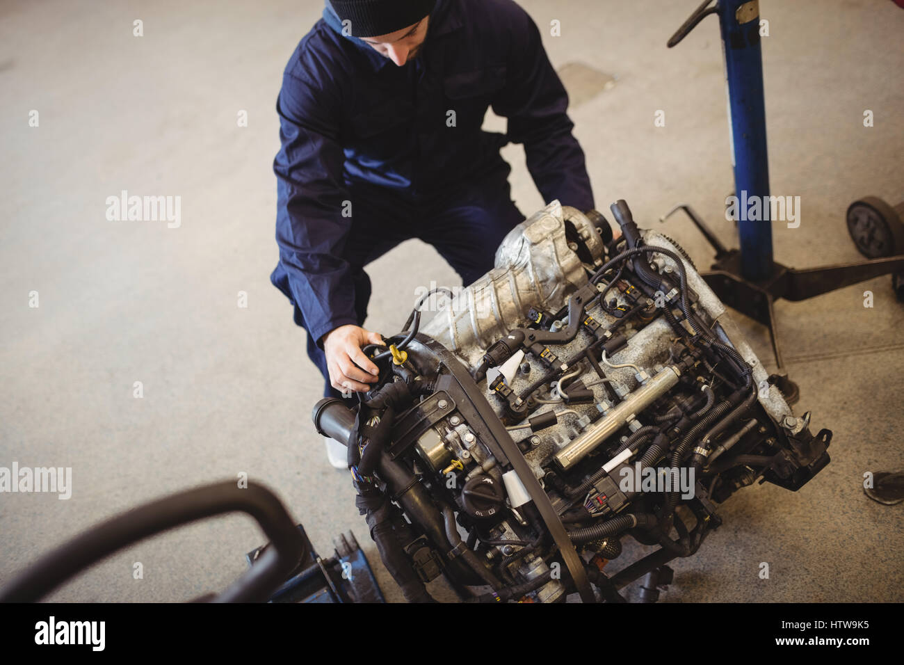 Mechanic checking a car parts Stock Photo - Alamy