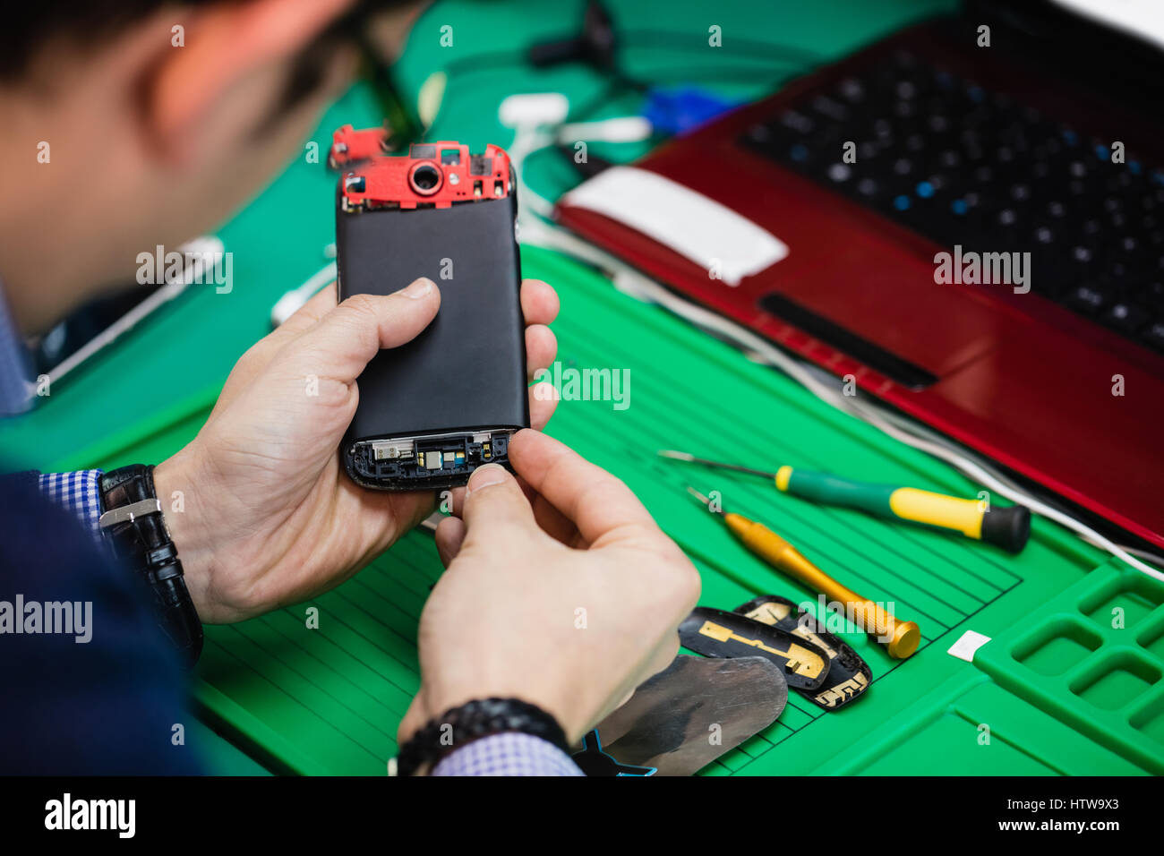 Mobile phone repairing Stock Photo - Alamy