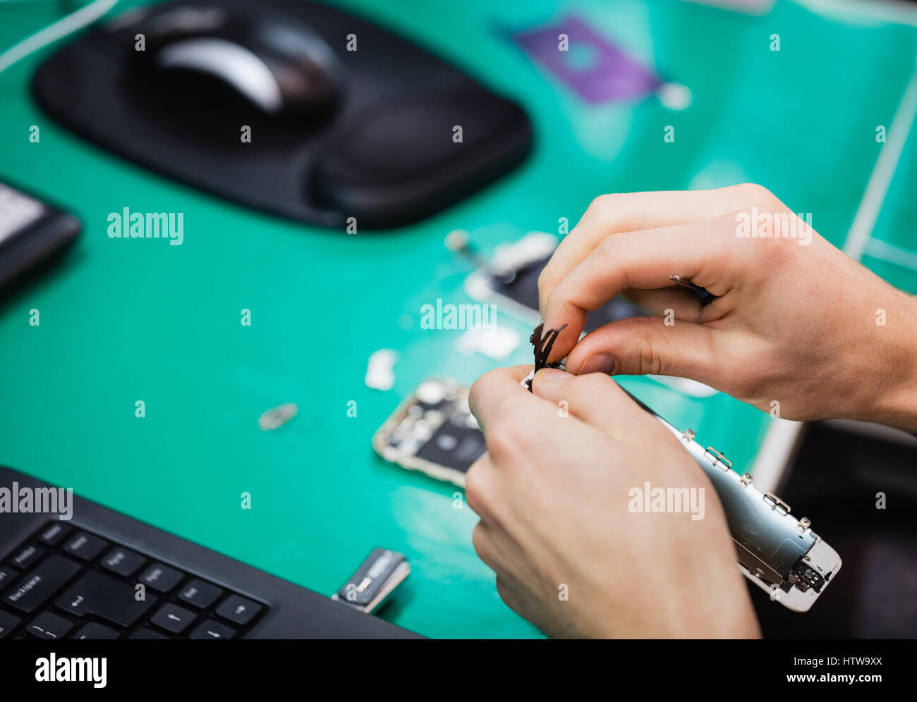 Man repairing mobile phone Stock Photo - Alamy