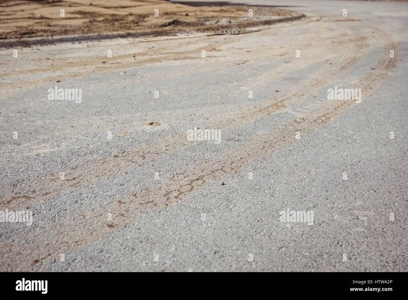 Tire track on road surface Stock Photo - Alamy