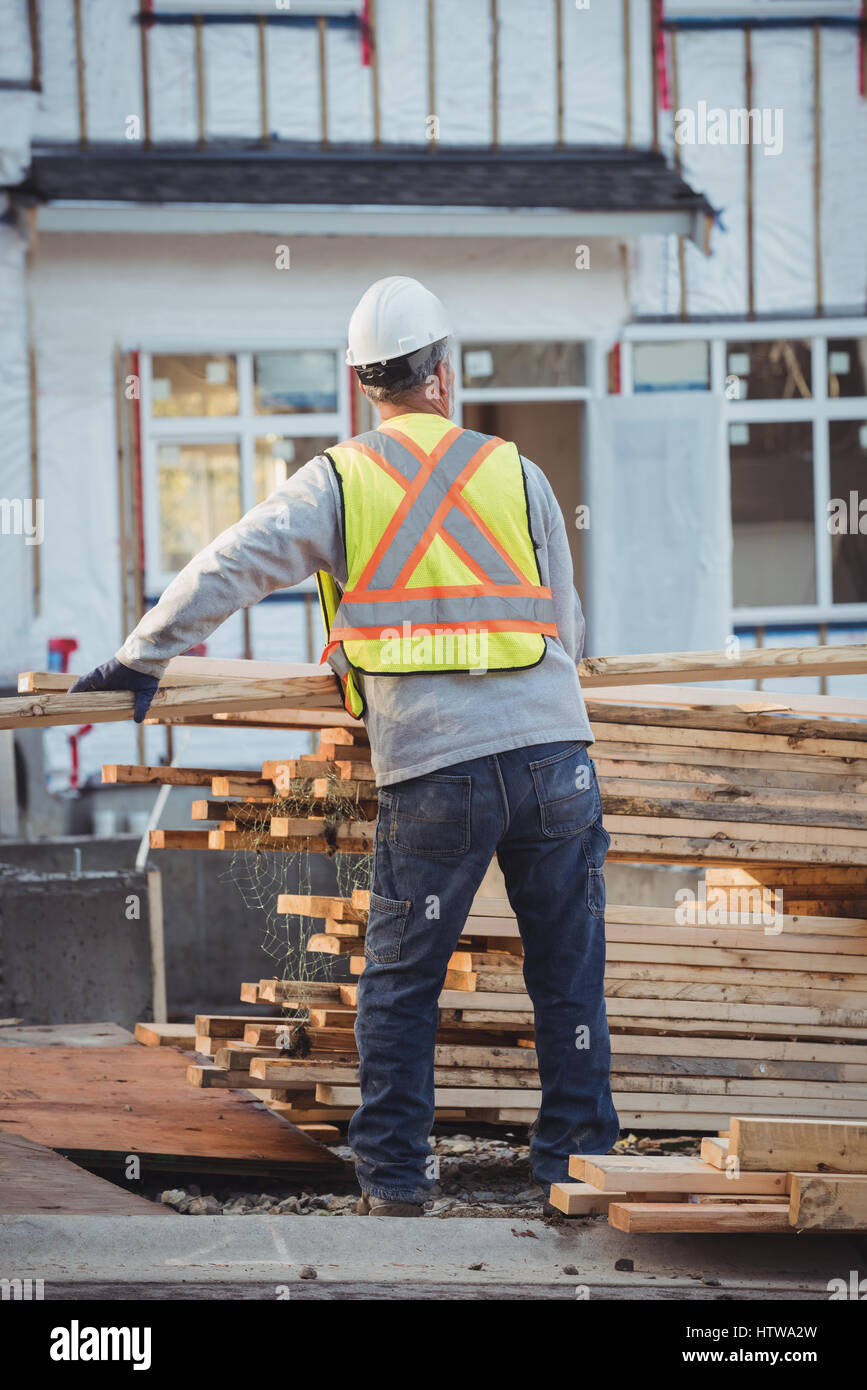 Construction worker working at construction site Stock Photo - Alamy