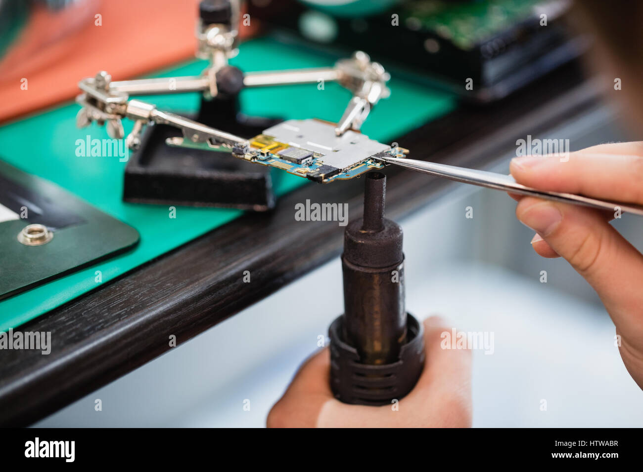 Man repairing mobile phone Stock Photo - Alamy