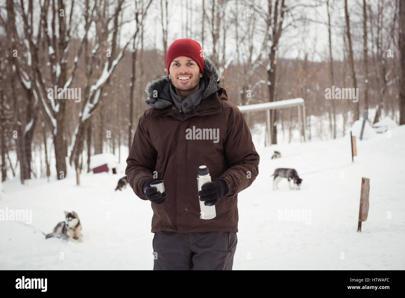 Musher holding thermos Stock Photo - Alamy