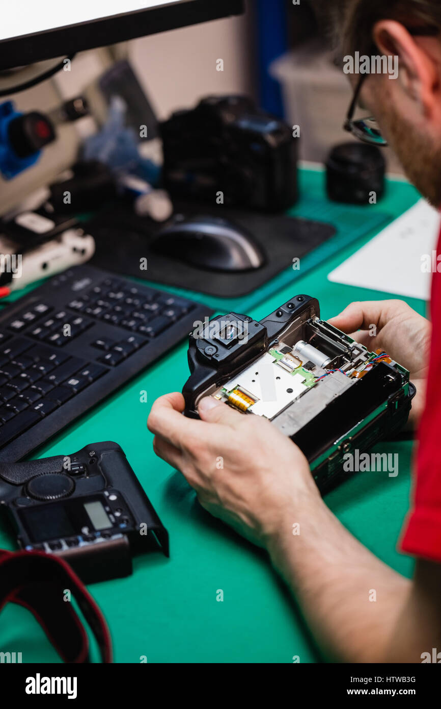 Man repairing digital camera Stock Photo - Alamy