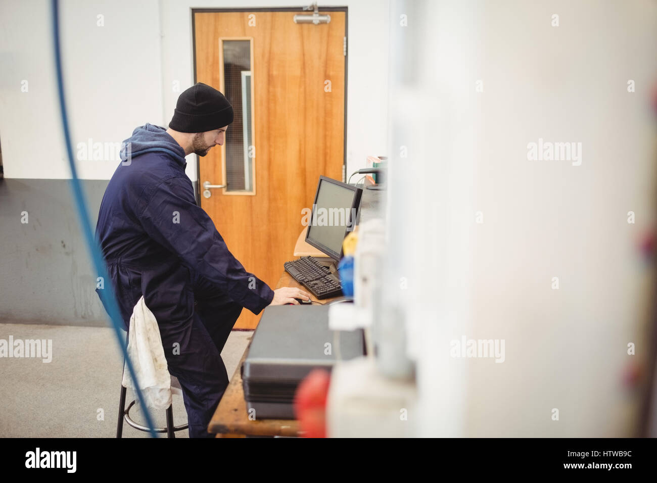 Mechanic working on personal computer Stock Photo - Alamy