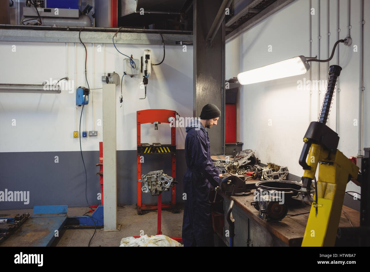Mechanic checking a car parts Stock Photo - Alamy