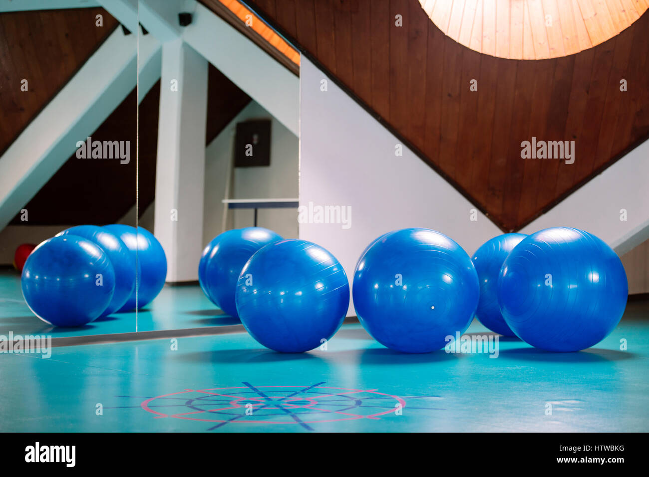 Group of blue pilates balls in the gym Stock Photo - Alamy