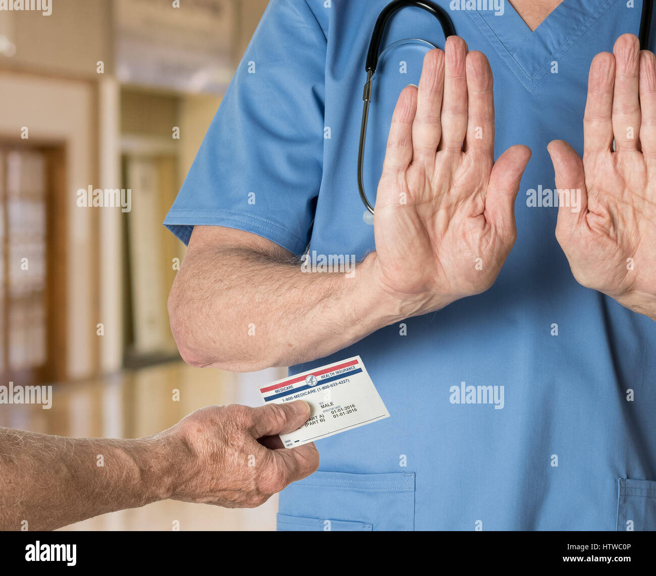 Senior doctor in scrubs refusing Medicare Card Stock Photo - Alamy