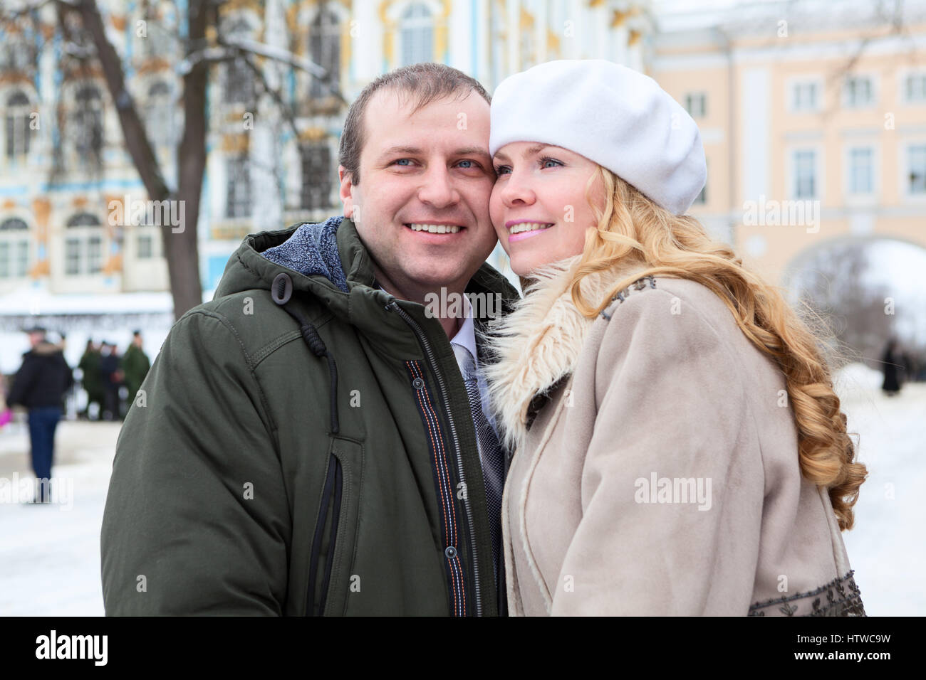 Married Caucasian couple touch each other cheek to cheek at frost ...
