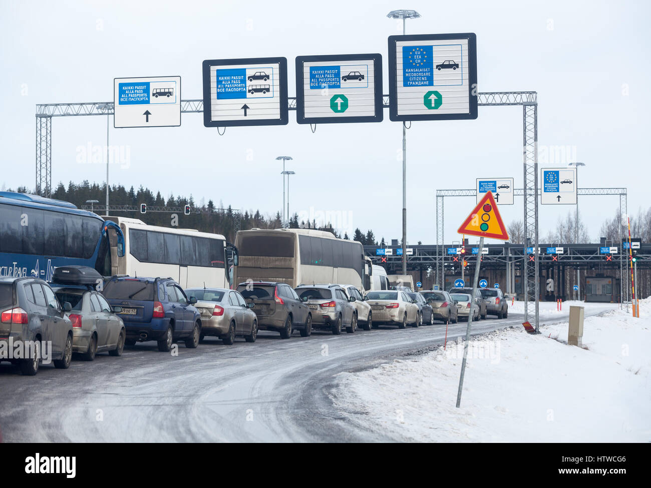 NUIJAMAA, FINLAND - CIRCA FEB, 2017: Passenger busses and cars stand in ...