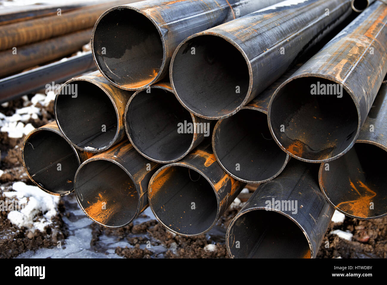 New steel pipes with rust lay on a construction site Stock Photo - Alamy