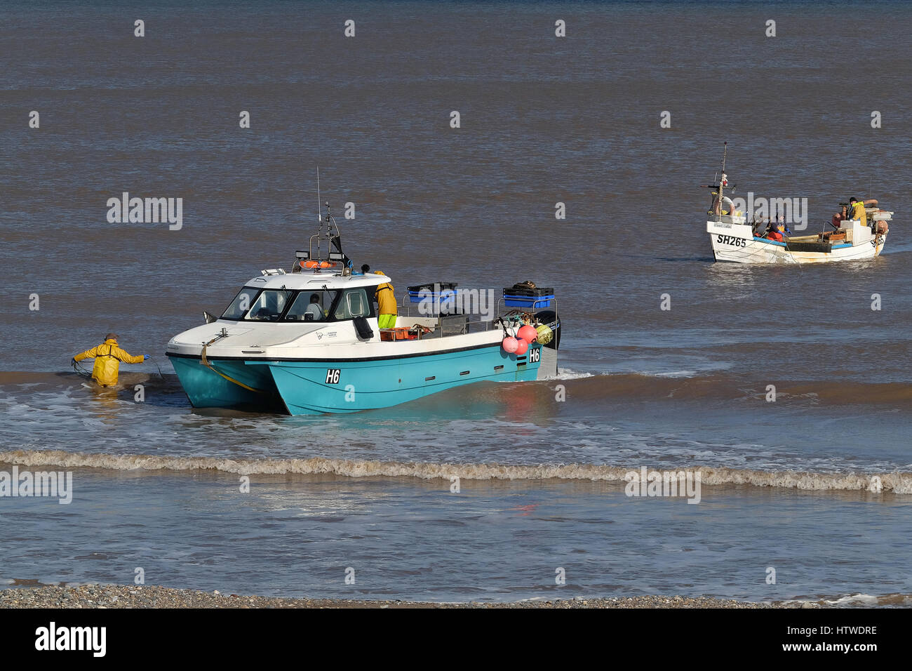 Shell fishing boat towing in smaller boat with engine trouble to the ...