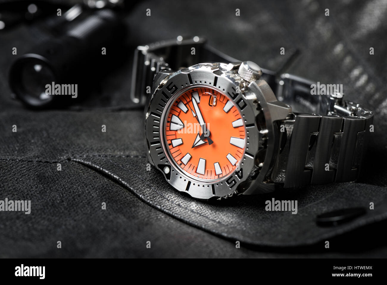 closeup watch for diver with orange dial Stock Photo - Alamy
