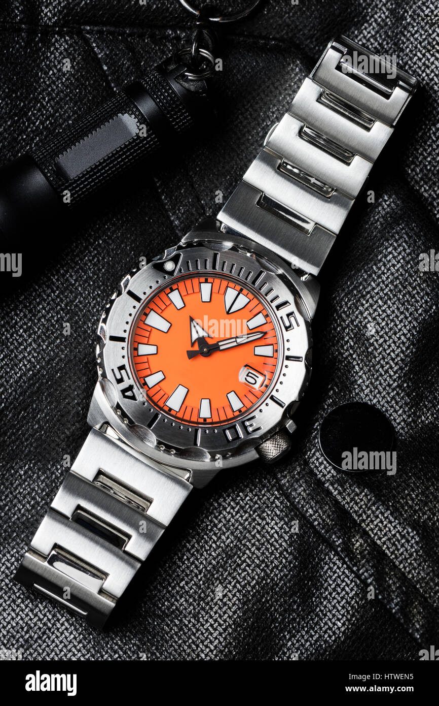 closeup watch for diver with orange dial Stock Photo - Alamy