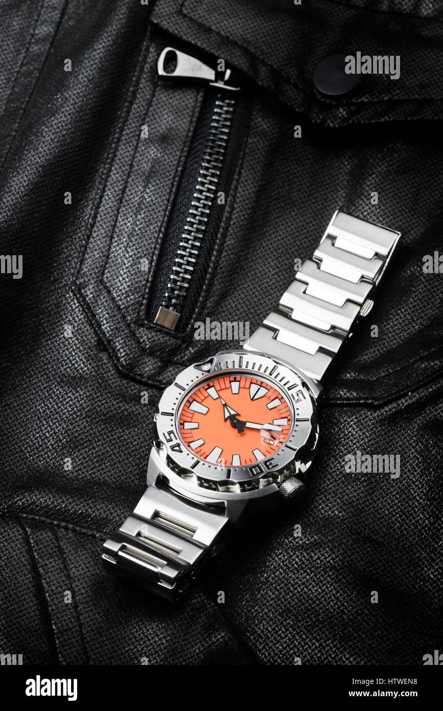 closeup watch for diver with orange dial Stock Photo - Alamy