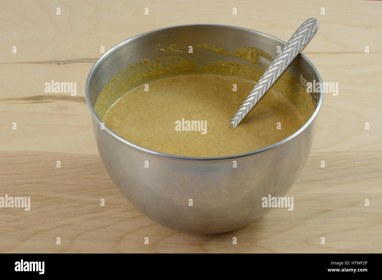 Mixing up gingerbread dough batter in stainless mixing bowl Stock Photo ...
