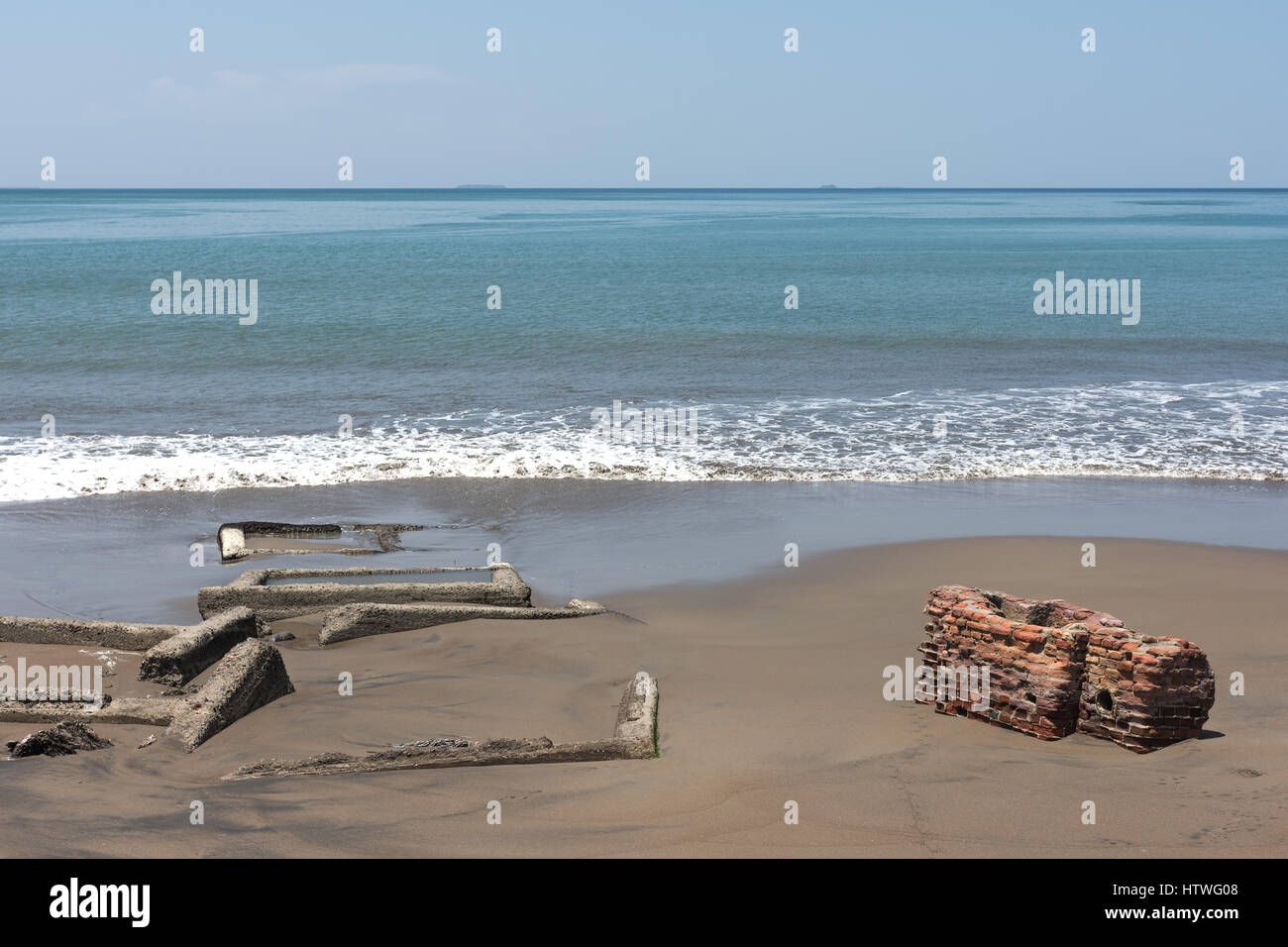 Modern Brick and concrete ruins of old beach side buildings buried in ...