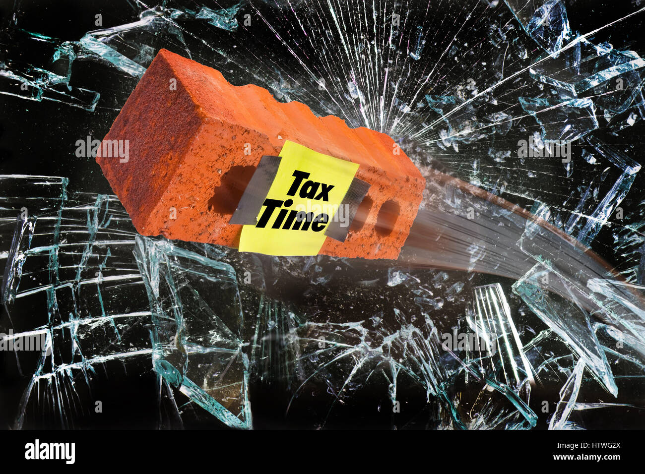 It's tax time with brick breaking glass window Stock Photo - Alamy