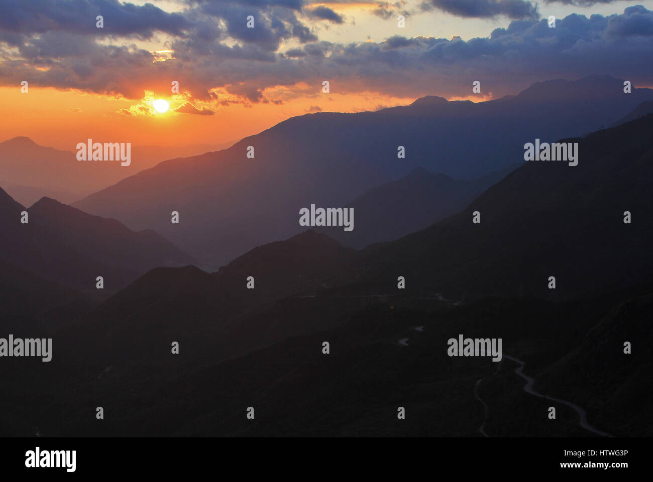 The sun behind the mountains at sunset, beautiful sunrise behind the ...