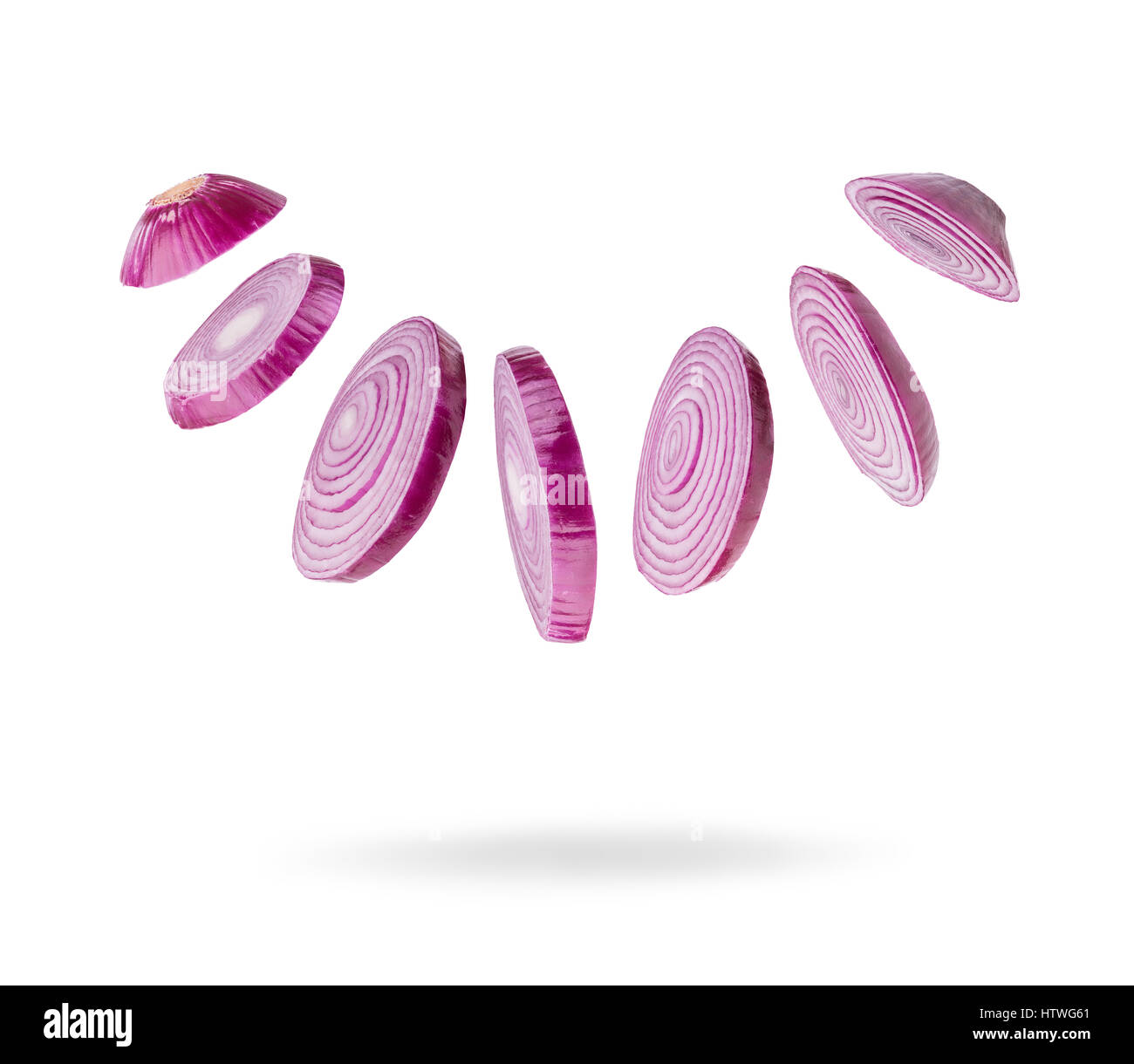 sliced and falling red onion isolated on white background Stock Photo ...