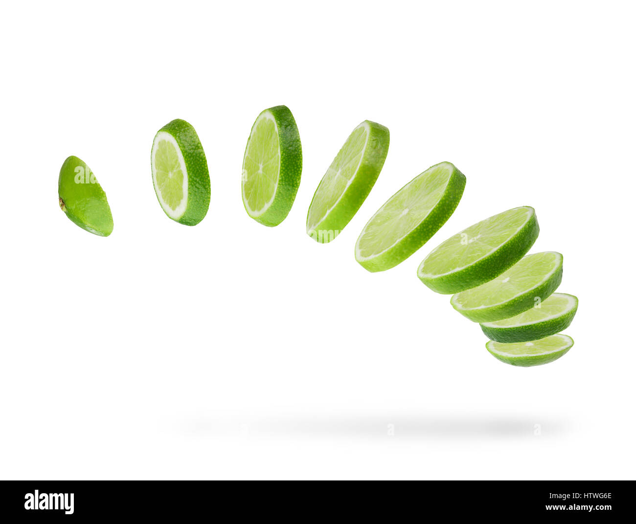 sliced and falling fresh lime isolated on white background Stock Photo ...