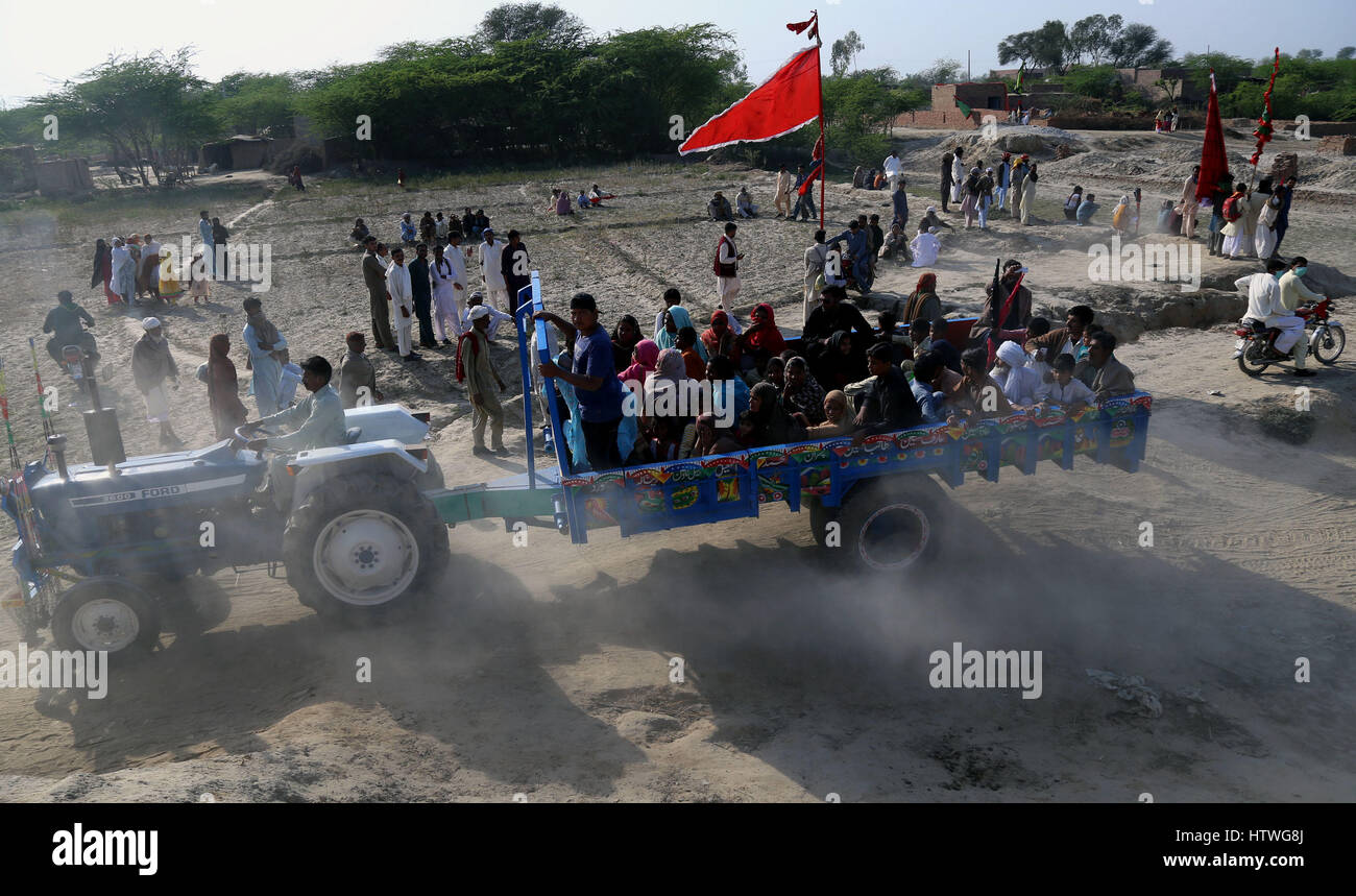 Hindu devotees carrying flags on their journey to the shrine of the ...