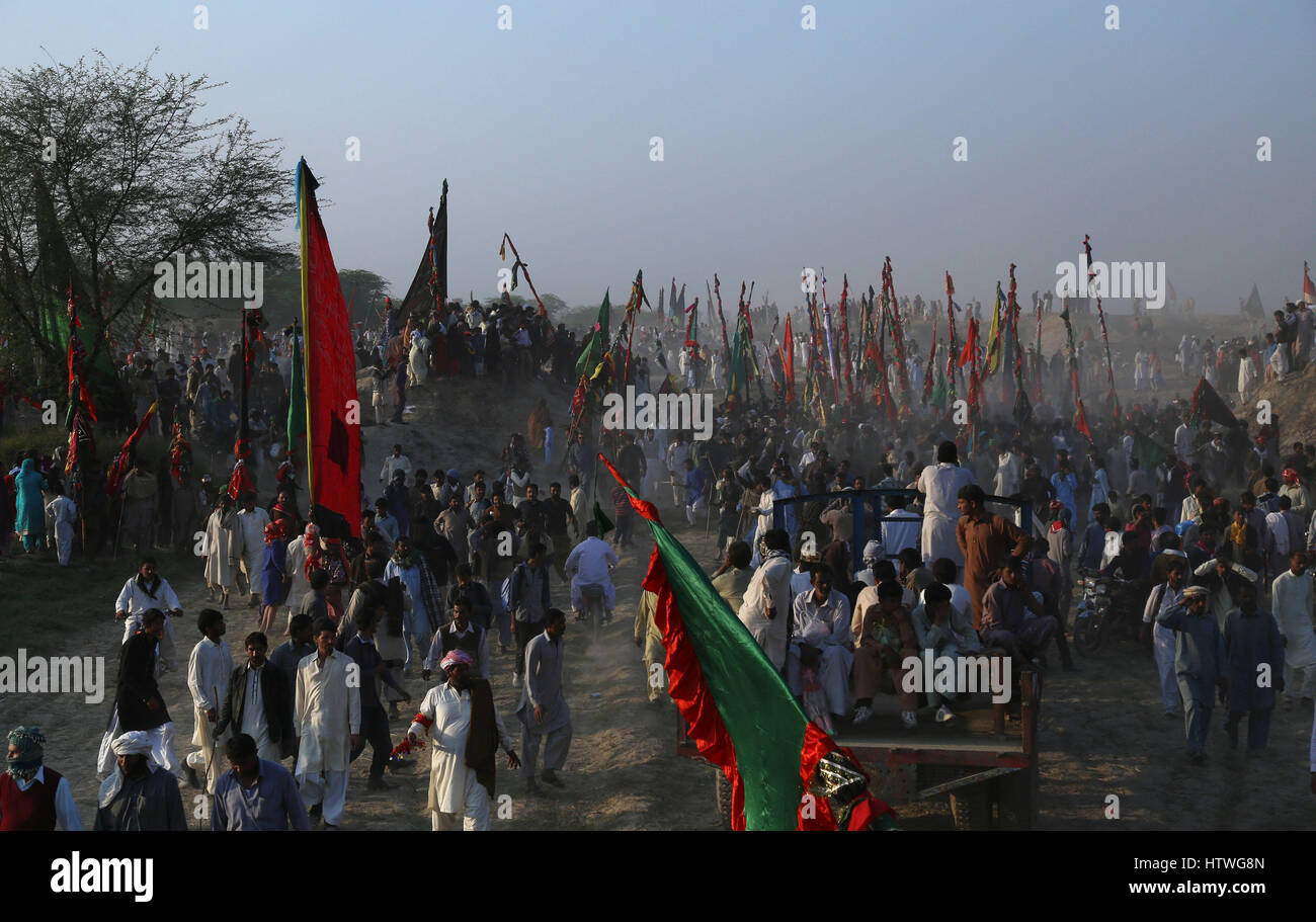 Hindu devotees carrying flags on their journey to the shrine of the ...