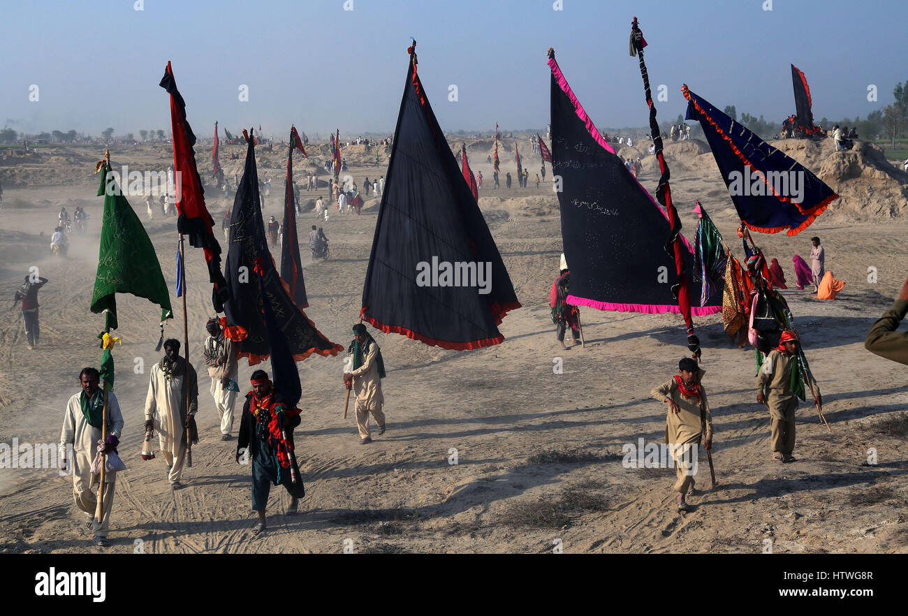 Hindu devotees carrying flags on their journey to the shrine of the ...