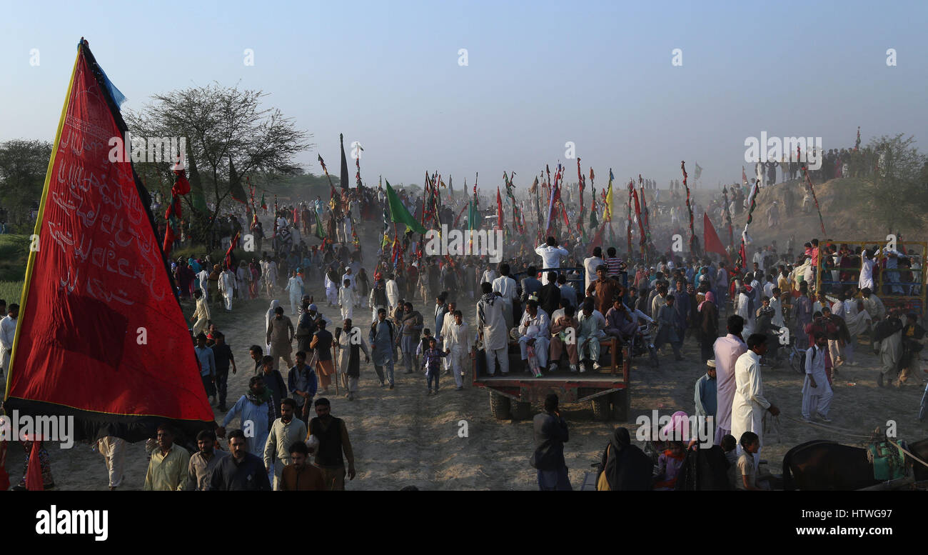 Hindu devotees carrying flags on their journey to the shrine of the ...