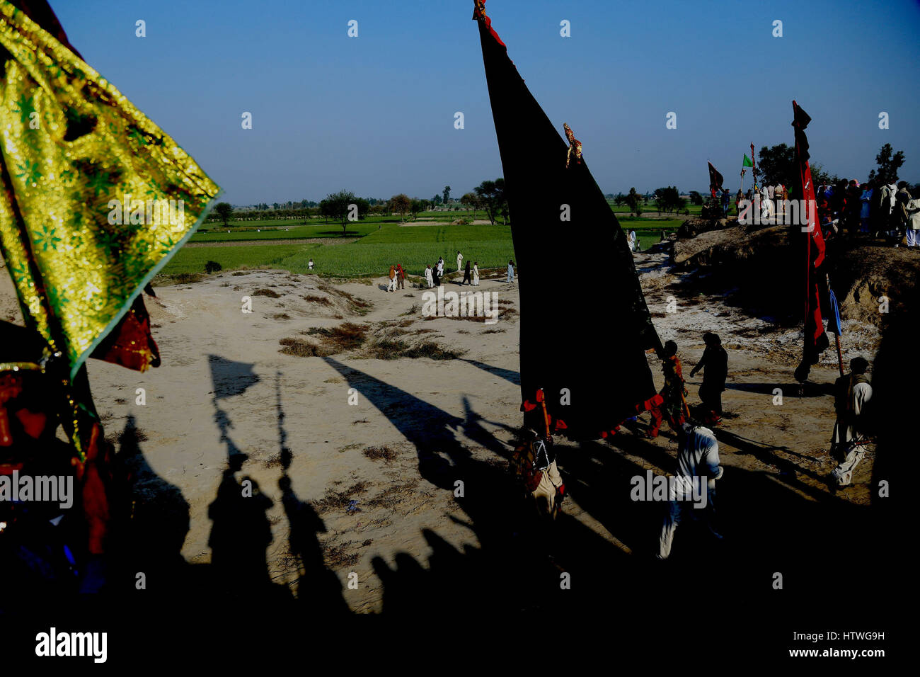 Hindu devotees carrying flags on their journey to the shrine of the ...