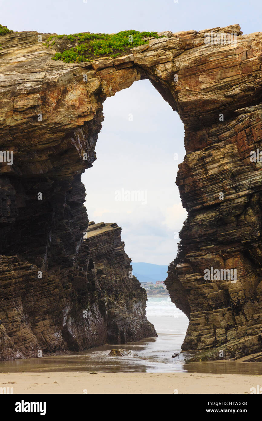Rock arch at Beach of the Cathedrals Natural Monument at Ribadeo ...