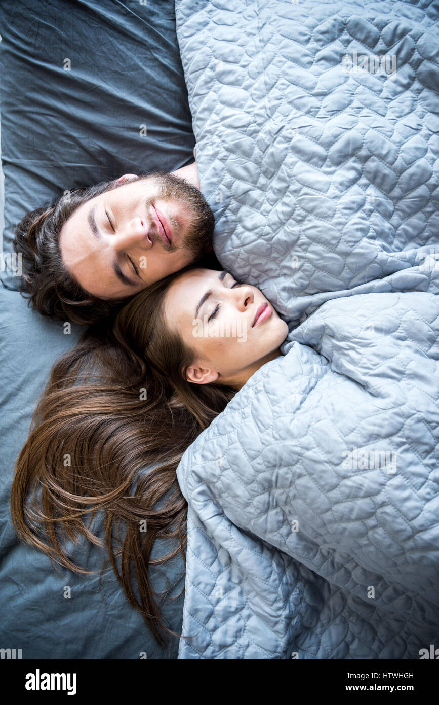 Top view young couple sleeping hi-res stock photography and images - Alamy