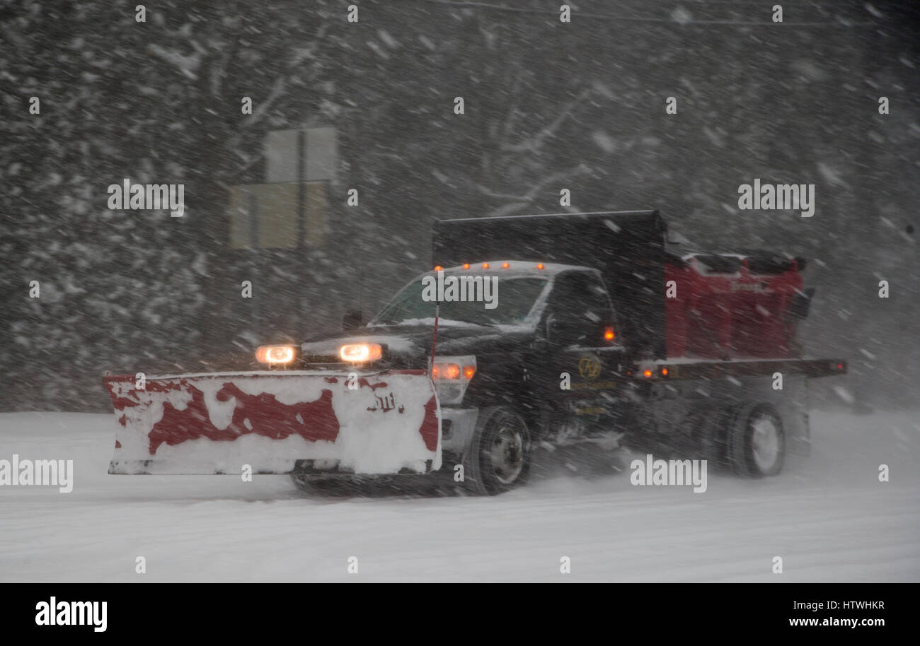A snowplow in a snowstorm Stock Photo - Alamy