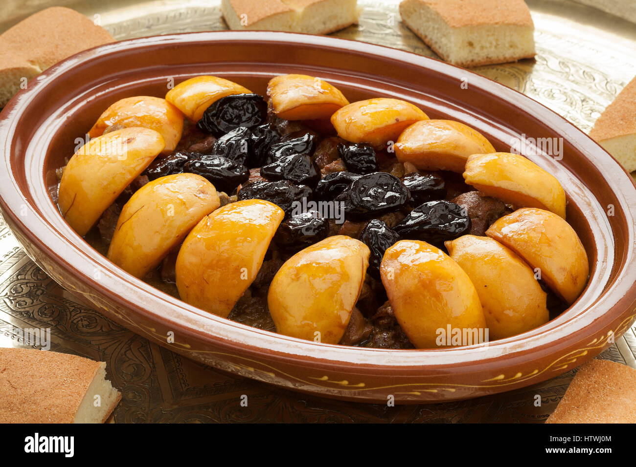 Traditional Moroccan festive dish with meat, quinces and prunes Stock ...